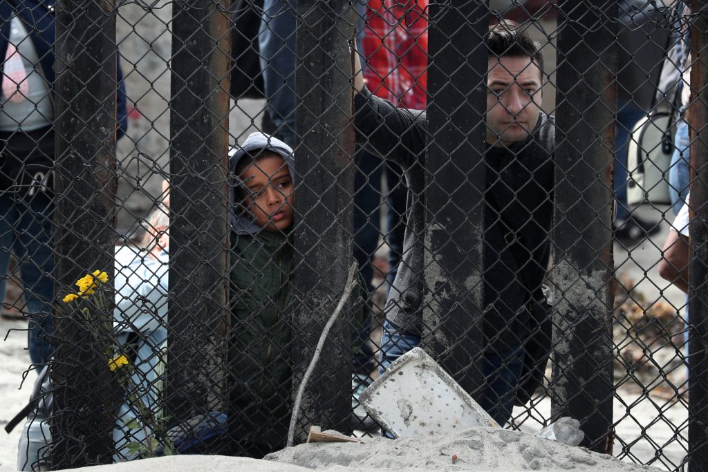 Migrants from caravan in limbo as U.S. says border crossing full