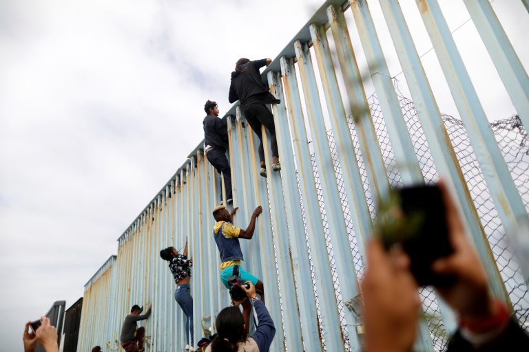 Migrants from caravan in limbo as U.S. says border crossing full