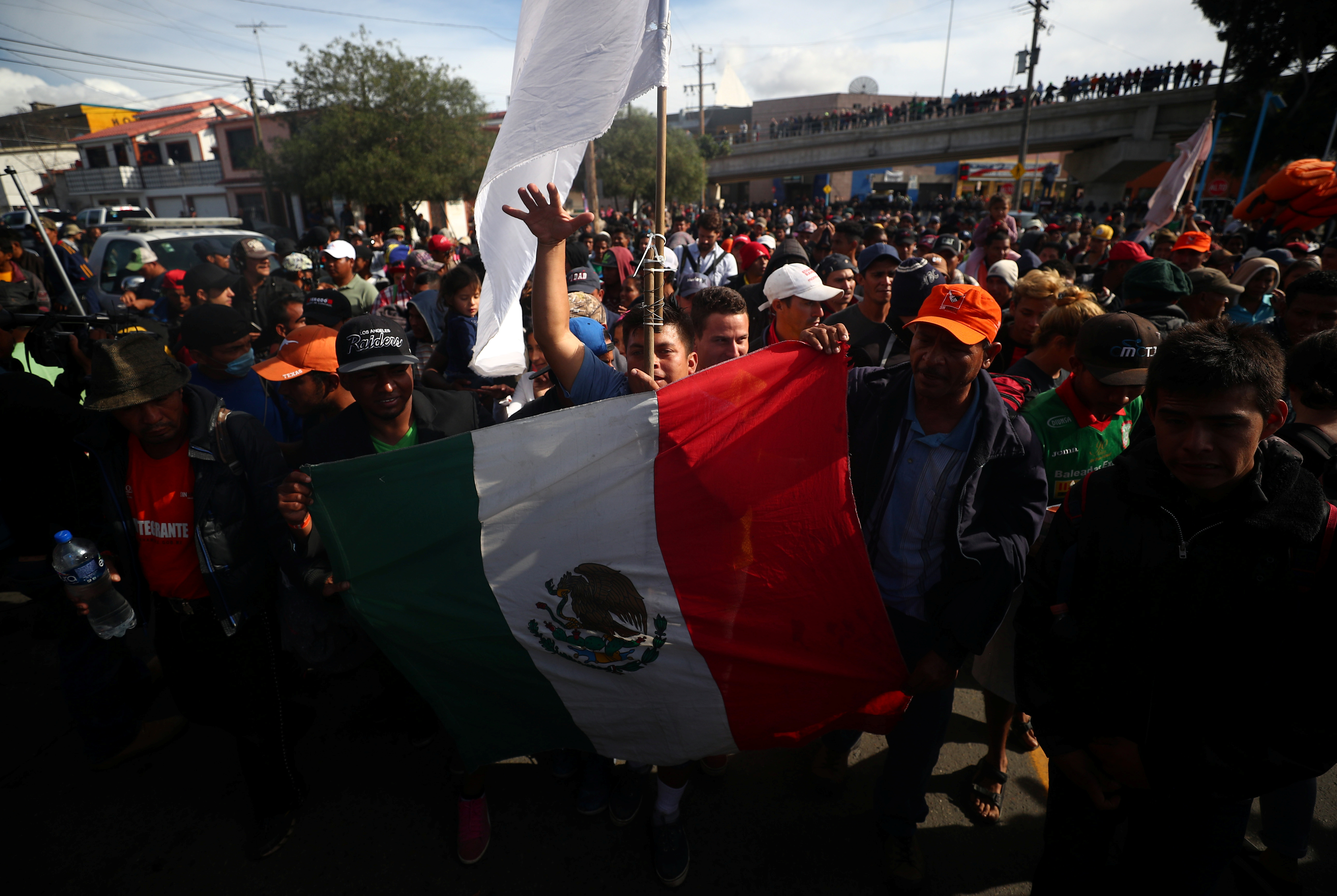 Tensions rise at U.S.-Mexico border as migrants, holiday travelers wait ...
